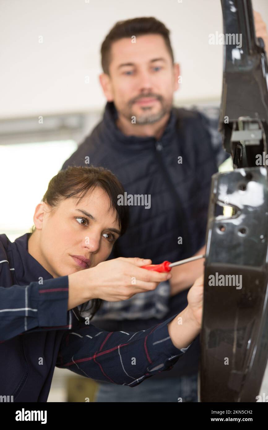 Female panel beater hi-res stock photography and images - Alamy