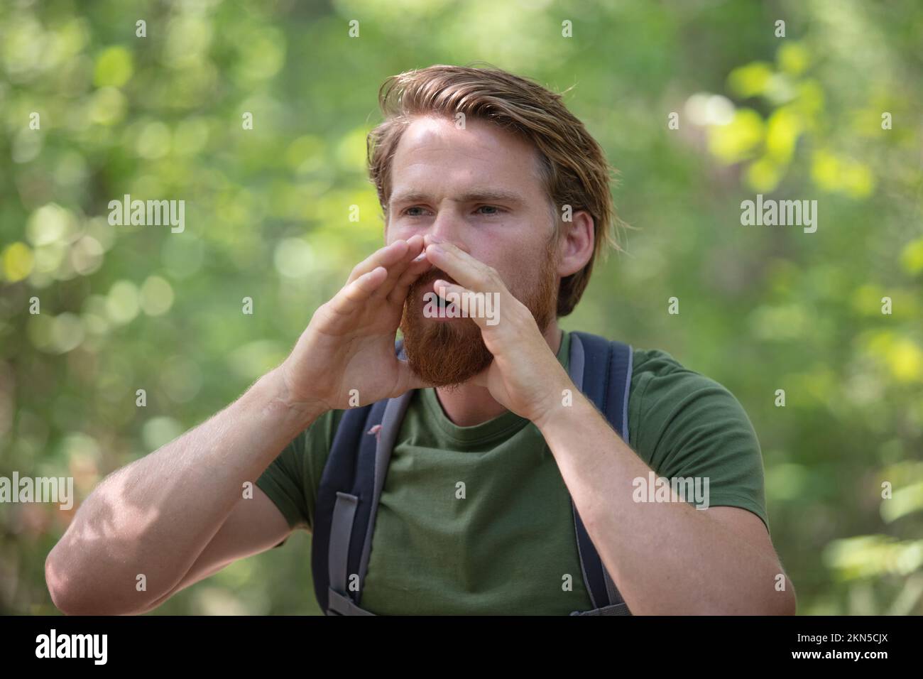 young man shouting and announcing something in a forest Stock Photo - Alamy young man shouting and announcing something in a forest Stock Photo - Alamy