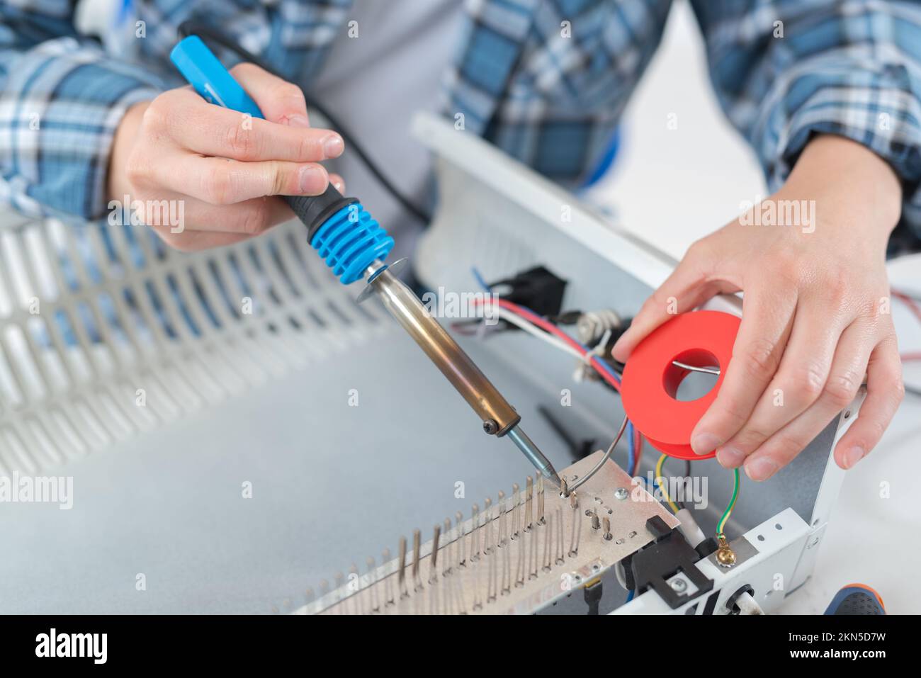 male hands close up soldering wires in radiator Stock Photo - Alamy