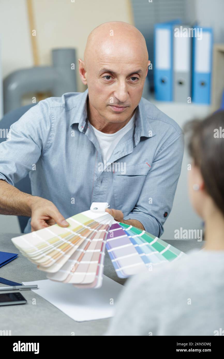 woman picking a color for her house walls Stock Photo - Alamy