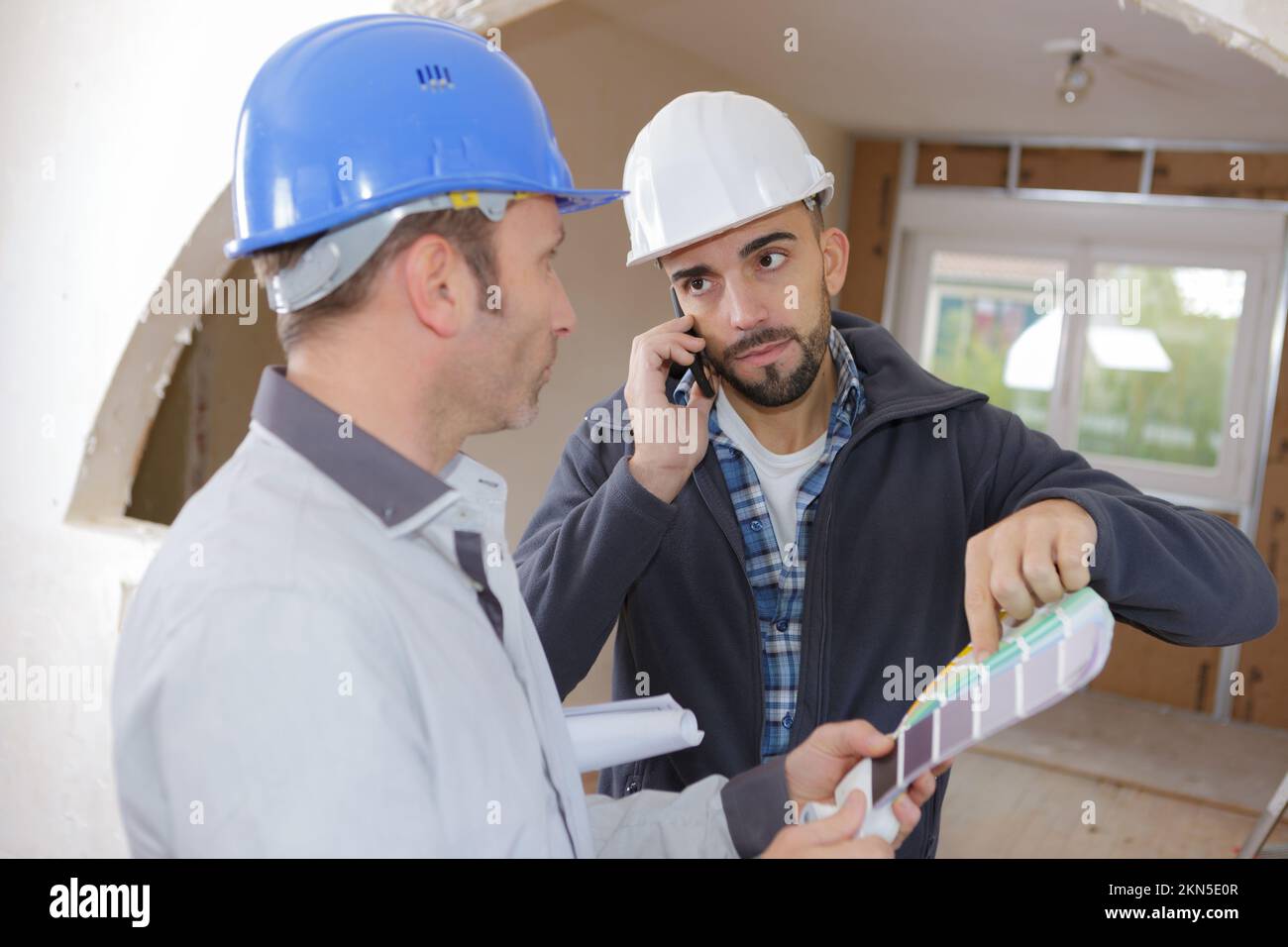 construction workers on building site Stock Photo - Alamy
