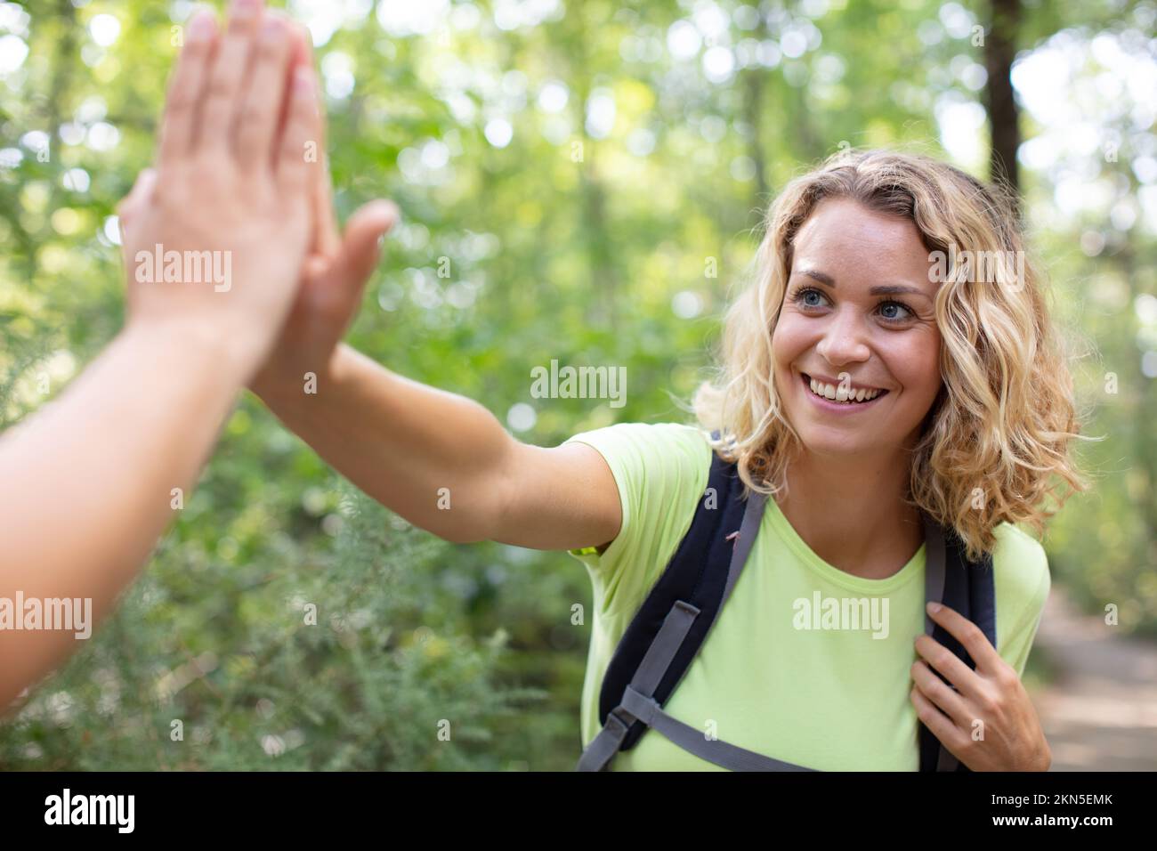 couple doing a handshake together at park Stock Photo - Alamy