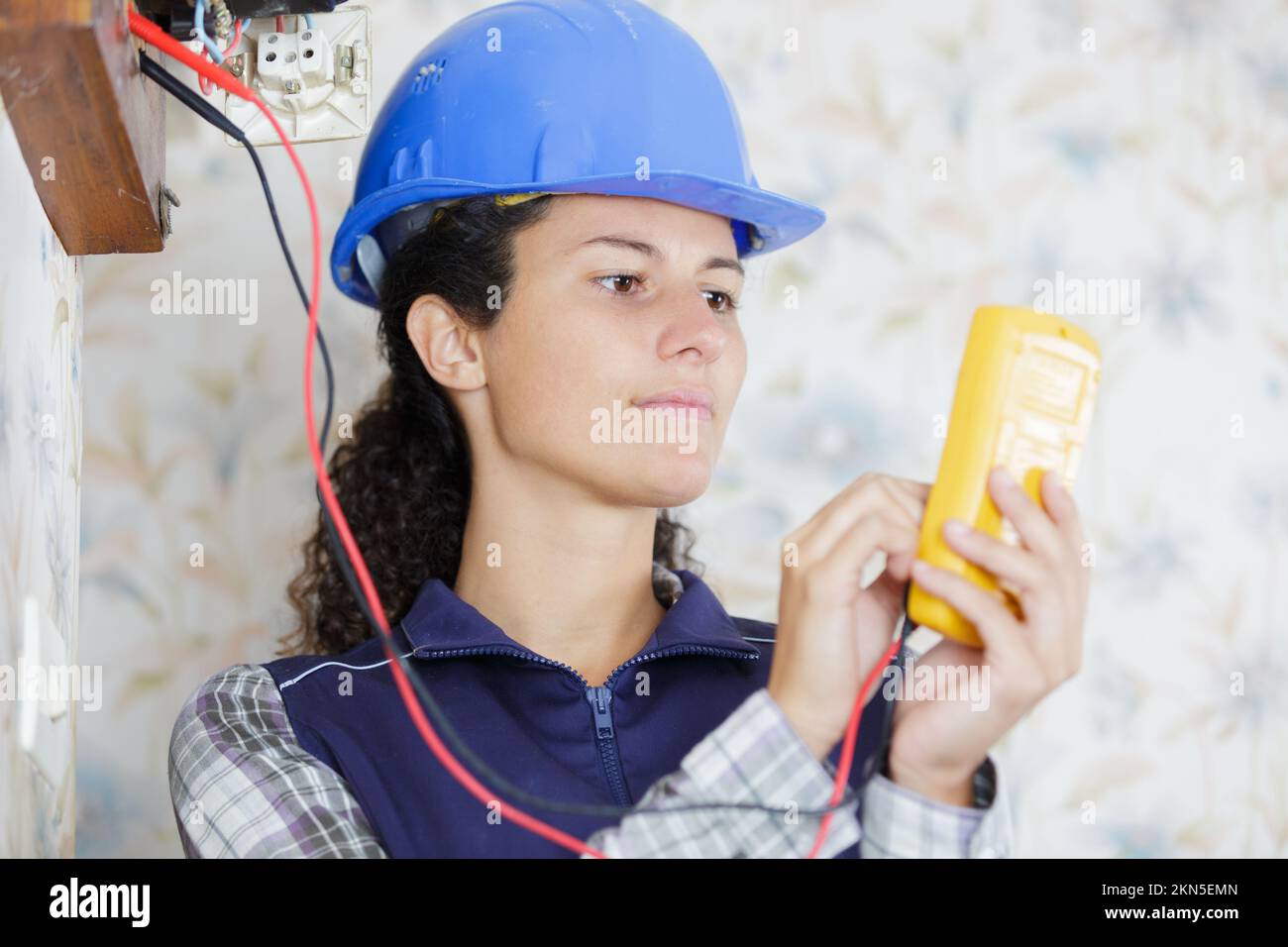 female electrician or engineer check or inspect electrical system ...