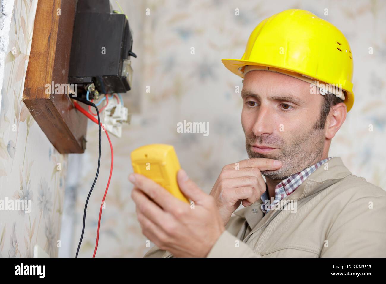 electrician technician at work on a residential electrical panel Stock ...
