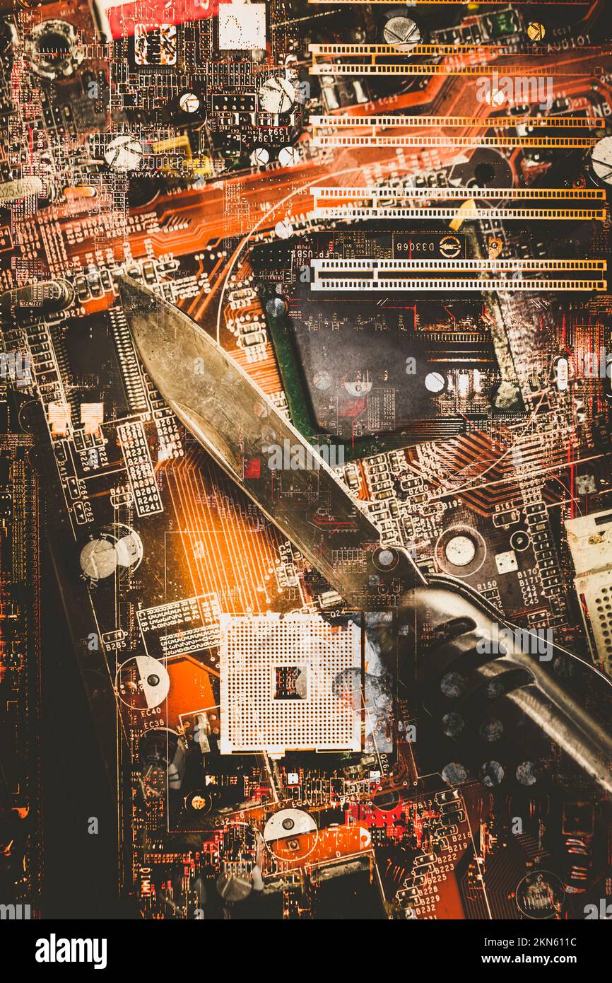 Stainless steel army knife on top of computer motherboard circuit ...