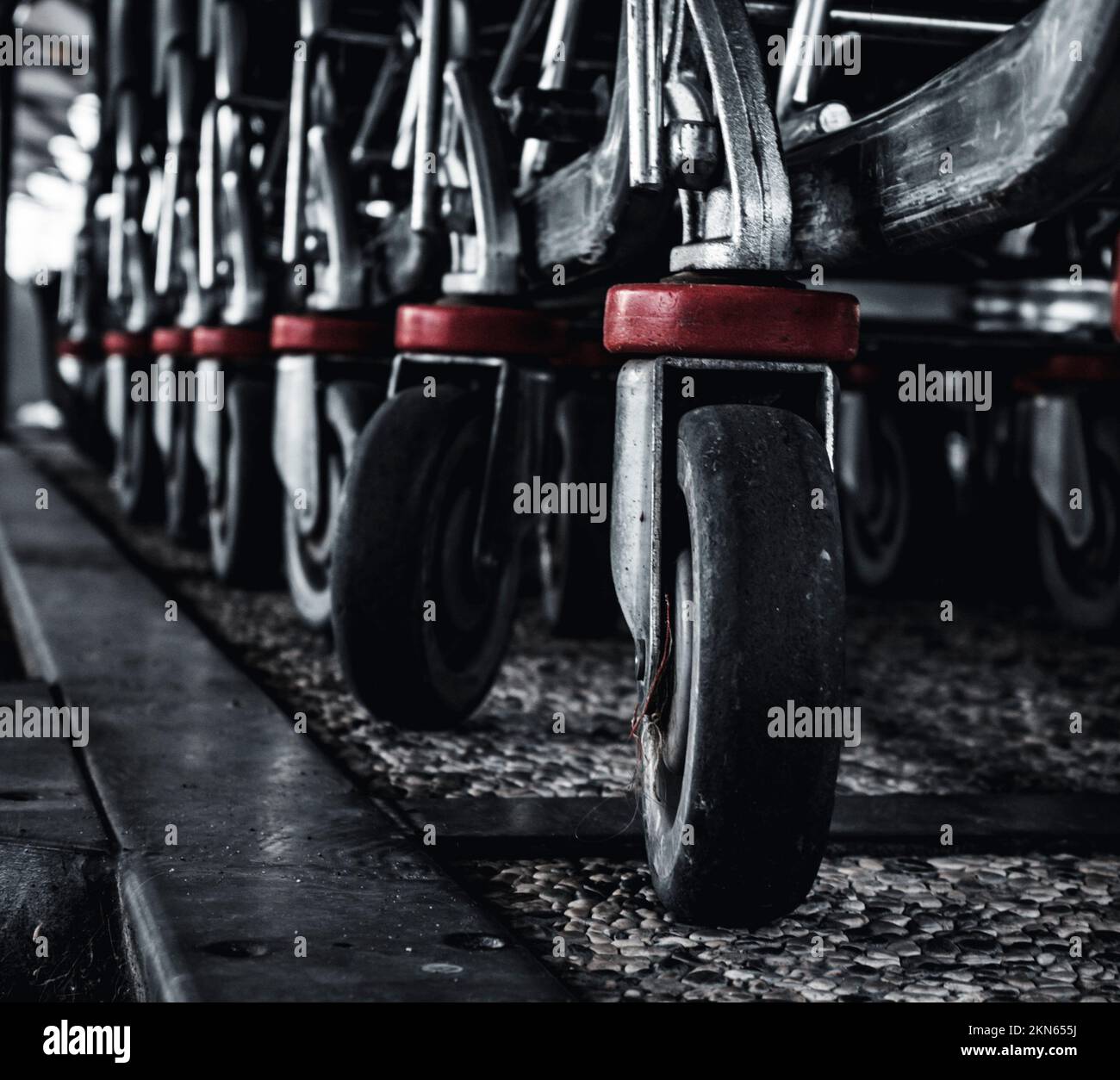 A selective focus shot of wheels of carts in the building Stock Photo ...