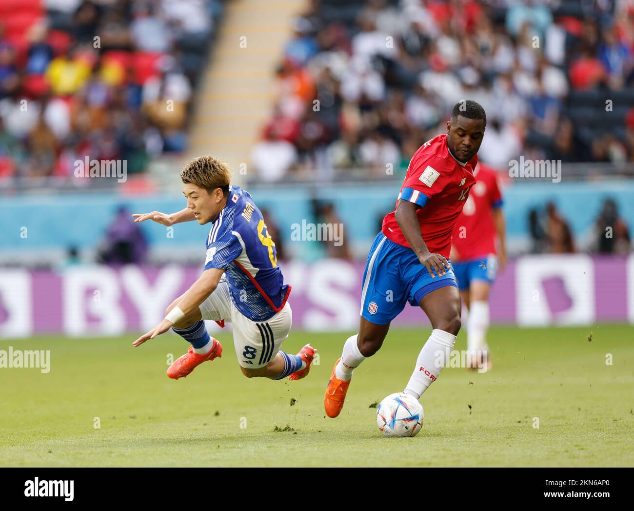 Al Rayyan, Qatar. 27th Nov, 2022. Doan Ritsu (L) of Japan vies with Joel Campbell of Costa Rica ...