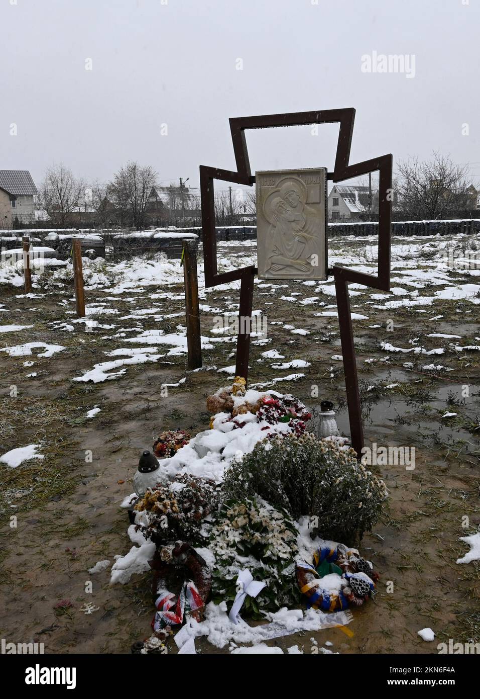 Illustration picture shows a grave with flowers during a visit to Bucha ...