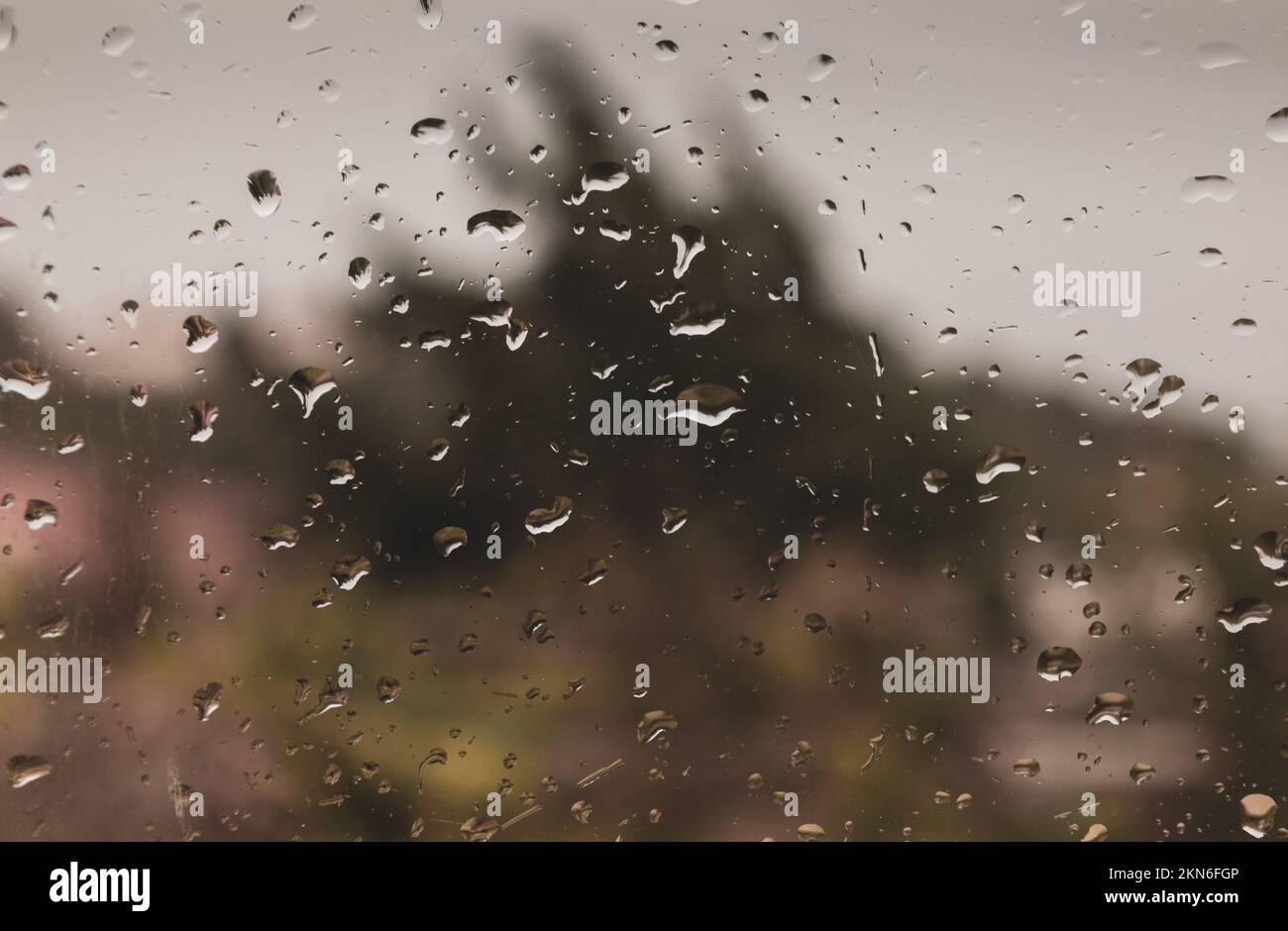 Raindrops behind the window. View of a windy and rainy day Stock Photo ...