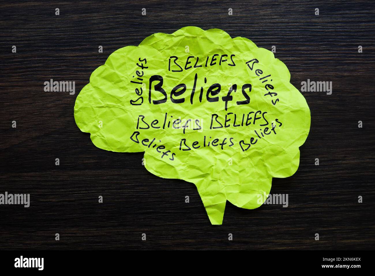 Paper brain with handwritten words beliefs. Bias concept Stock Photo ...