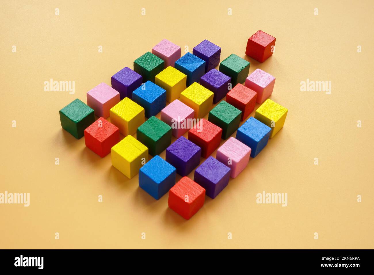 Colorful cubes and one on the top as a leader. Diversity in company ...