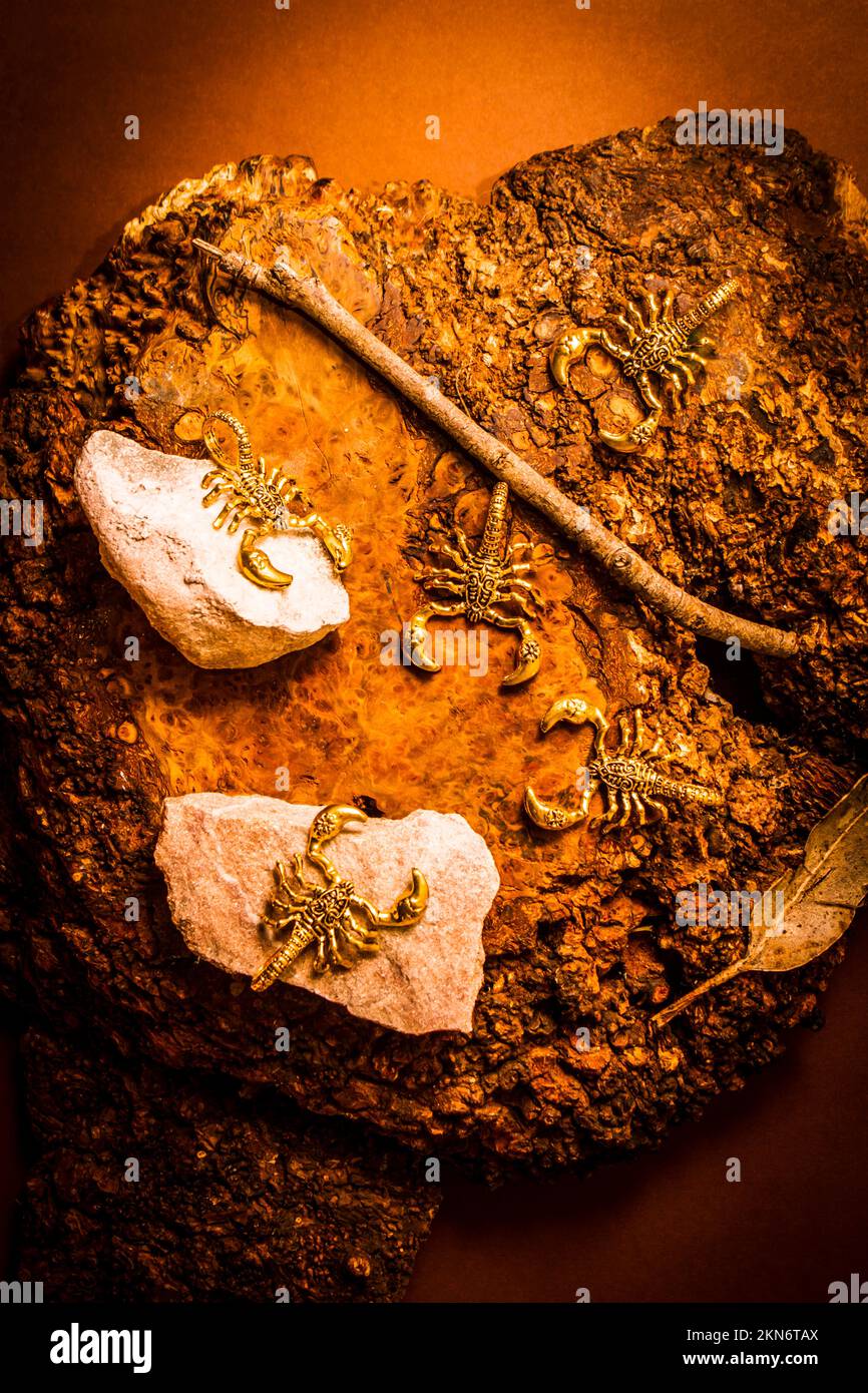 Egyptian stylised artwork on a ornate collection of gold scorpions on ...