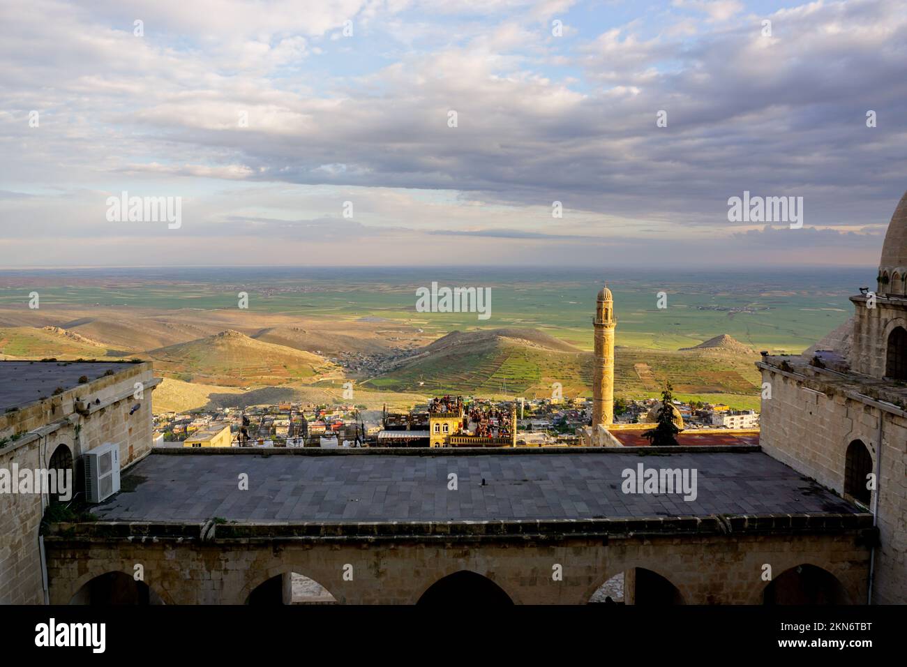 An aerial view of the Mardin landscape at sunset with the minaret of ...