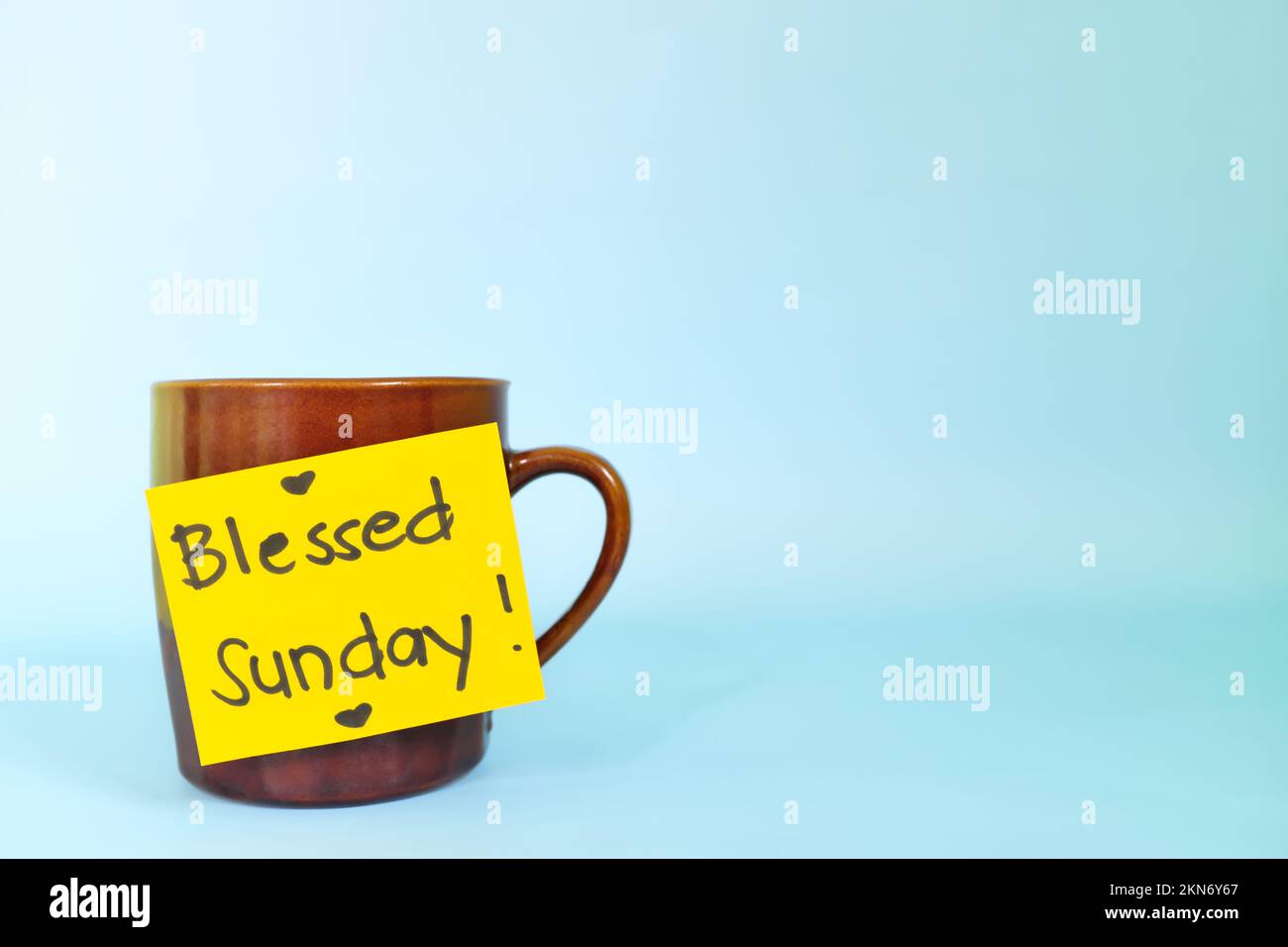 Blessed Sunday concept. Selective focus of coffee cup with bright ...