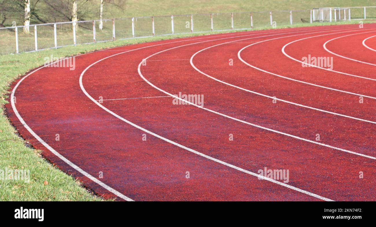 A Corner on a Red Surface Athletics Running Track Stock Photo - Alamy
