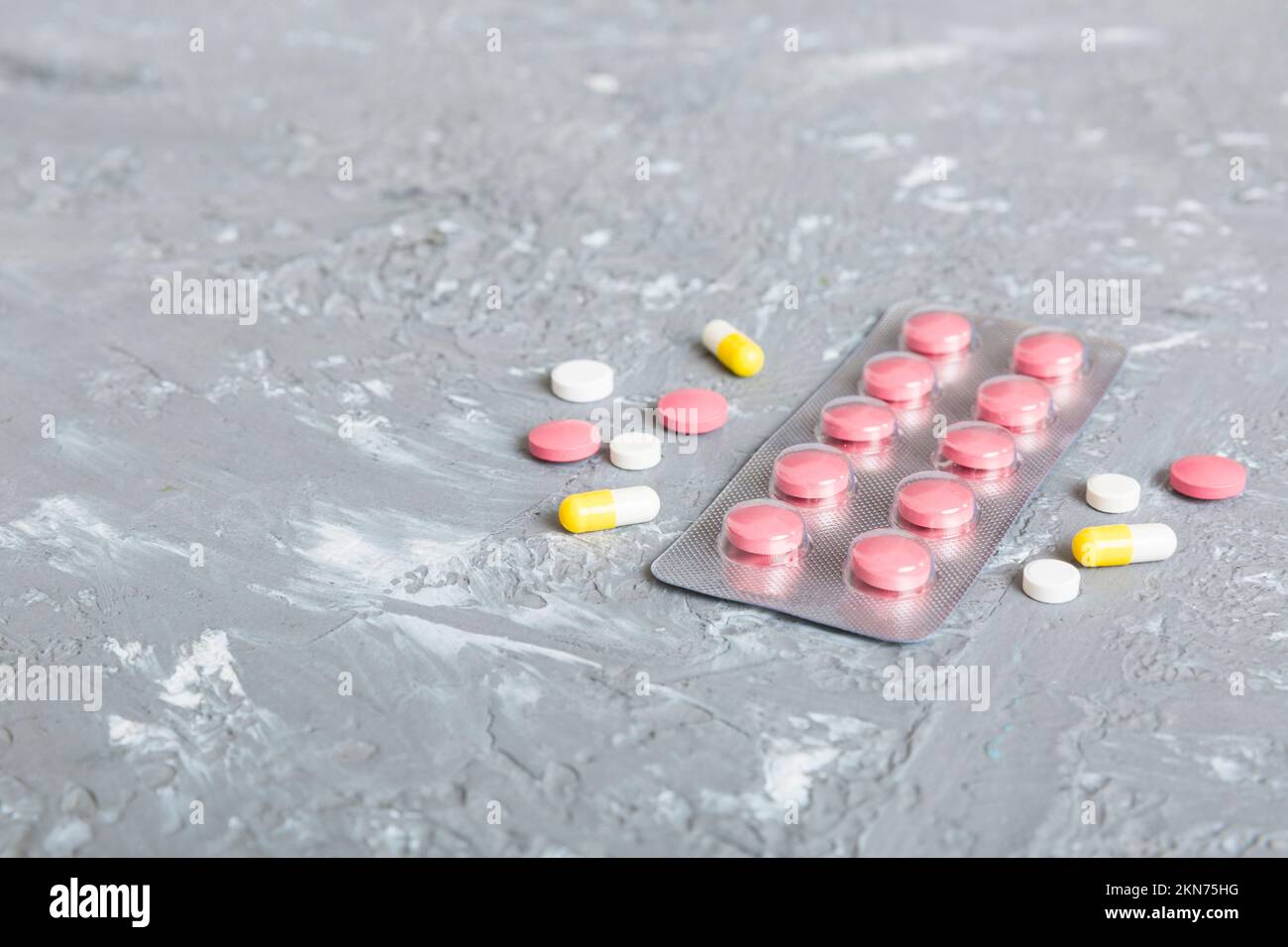 Blister package with Vitamin on color background. Medicine pills on a ...