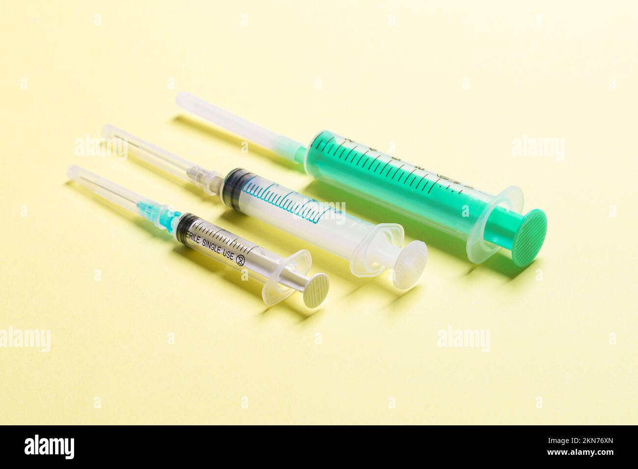 Top view of different syringes for injection on colorful background ...