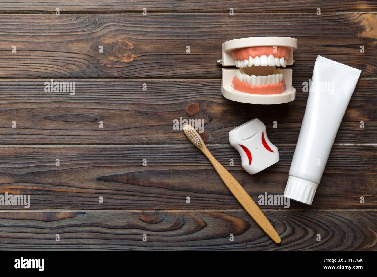 Mouthwash and other oral hygiene products on colored table top view ...