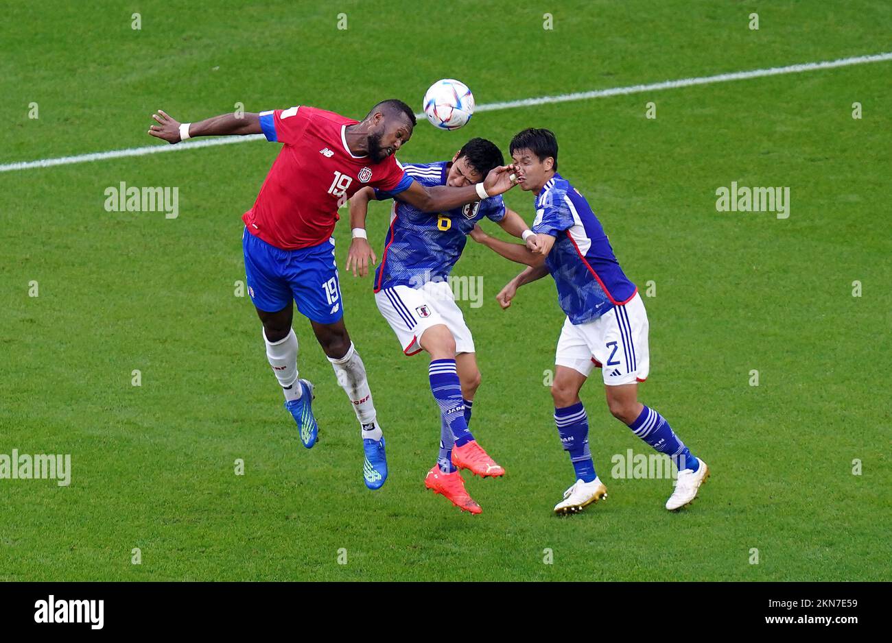 Costa Rica's Kendall Waston battles for the ball with Japan’s Ritsu Doan and Miki Yamane during ...