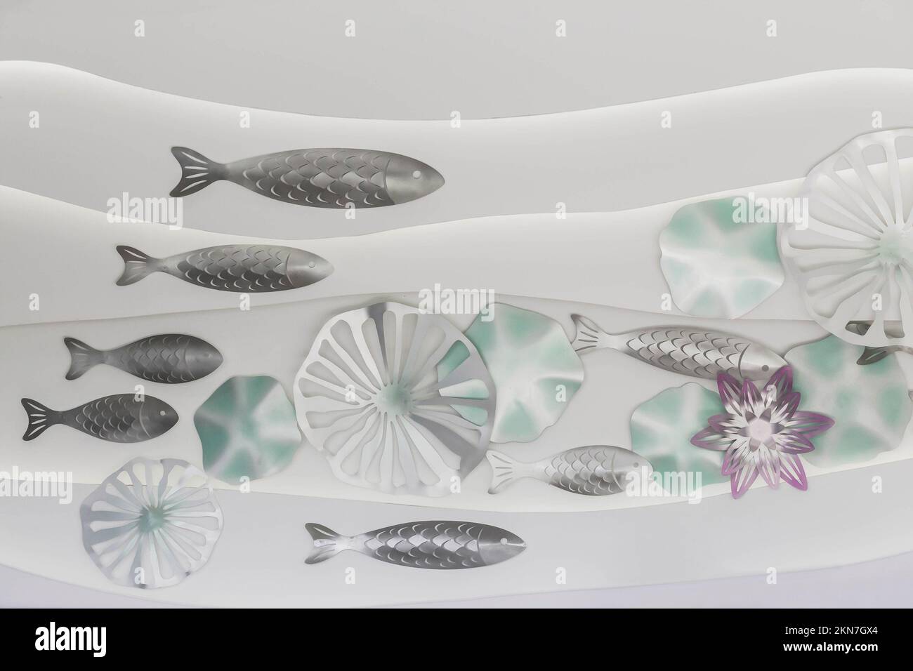 Marine background. Cardboard fish on the wall in the children's room ...