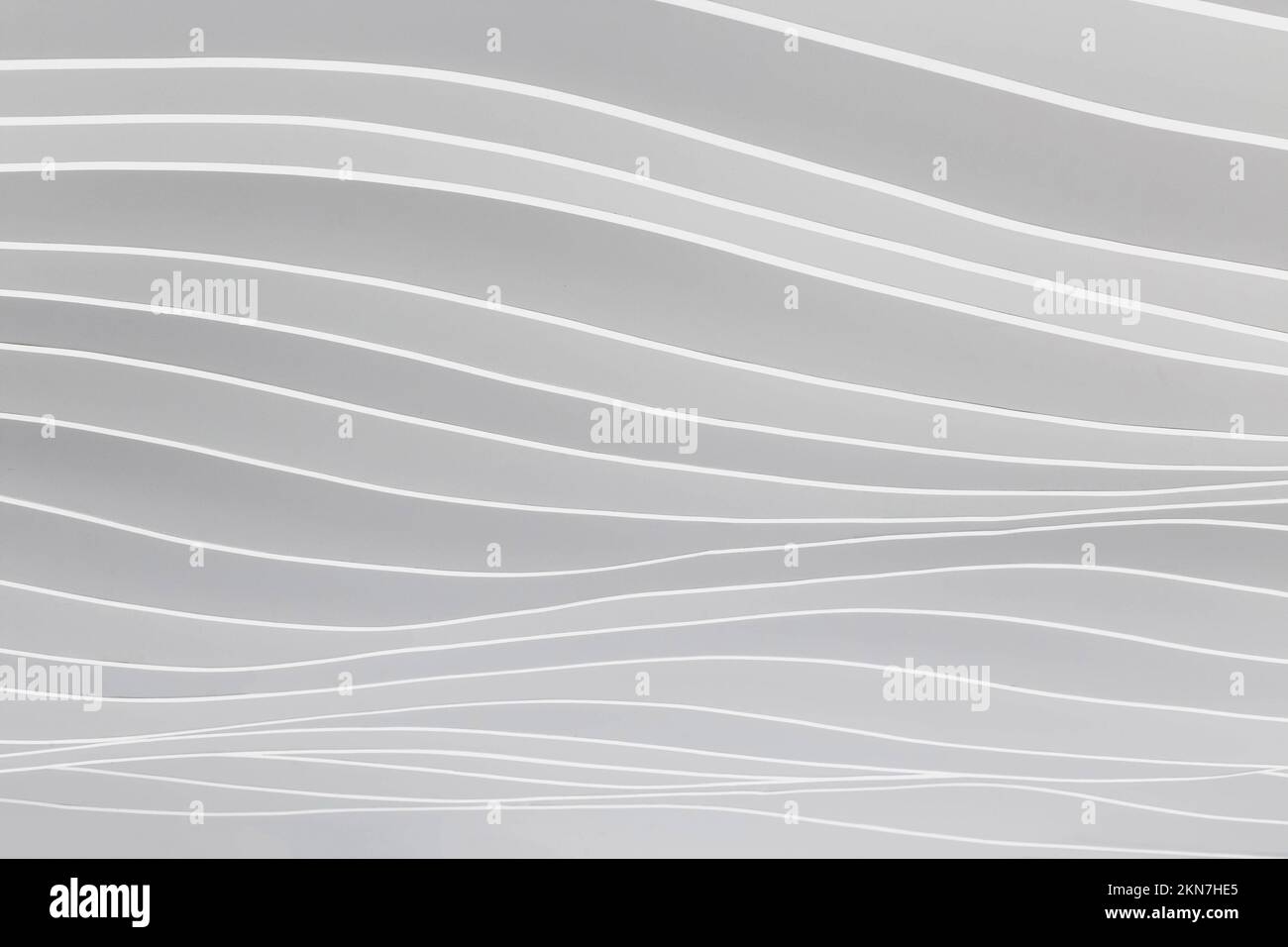 Gray wall decorated with cardboard waves. Background Stock Photo - Alamy