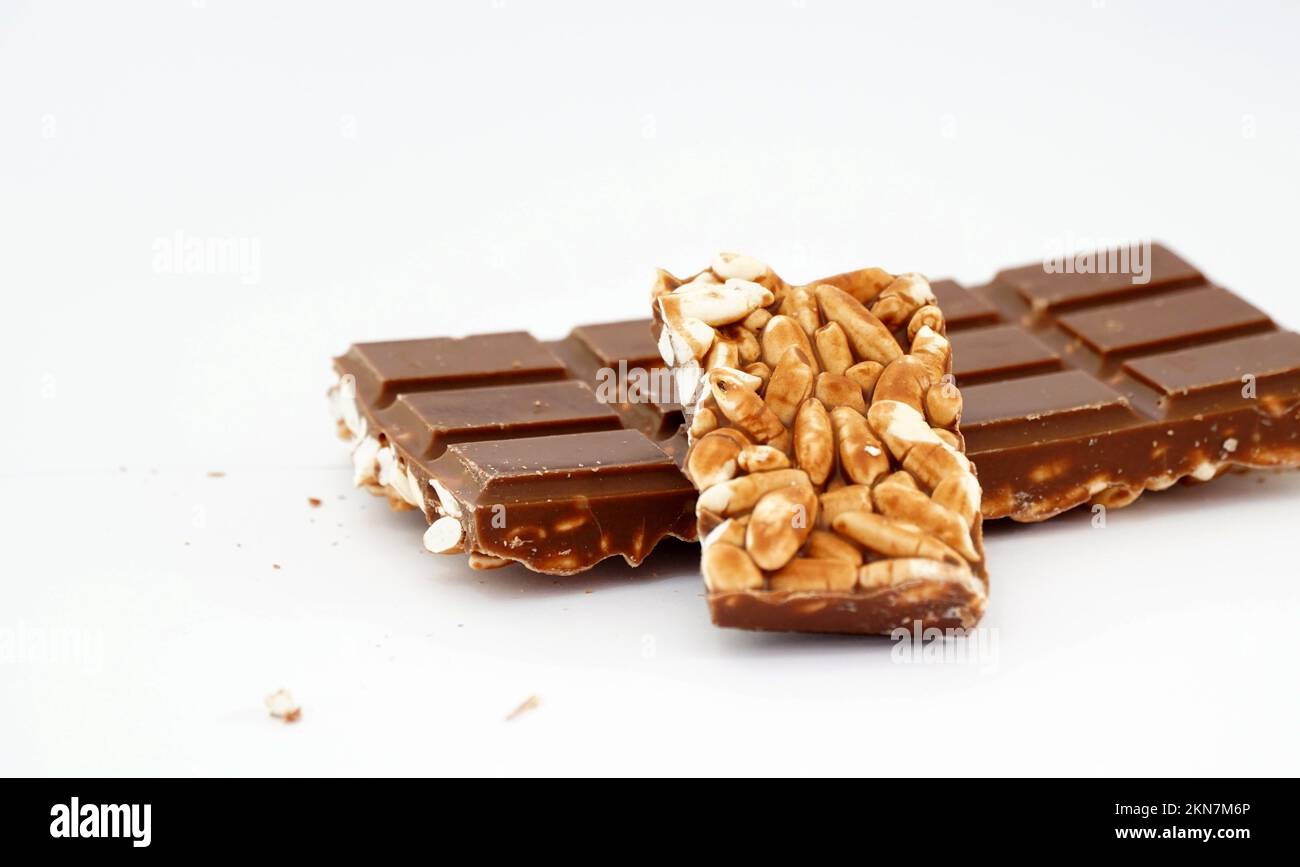 pieces of rice chocolate bar over white background Stock Photo - Alamy