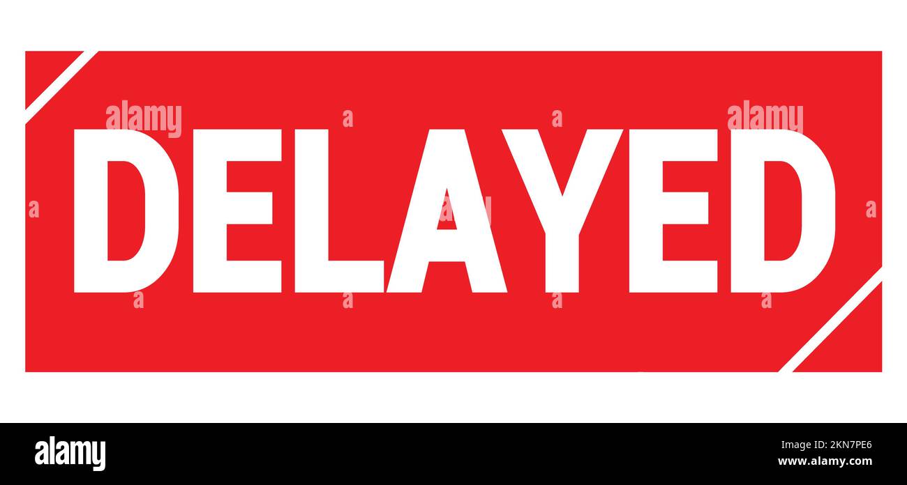 DELAYED text written on red grungy stamp sign Stock Photo - Alamy