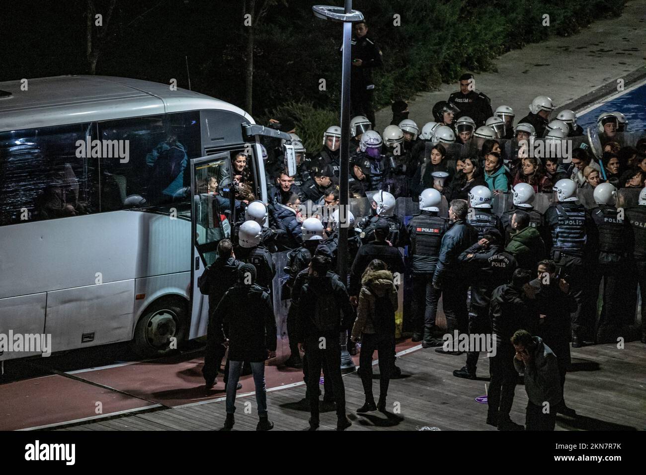 Turkish riot police surround women as they take part in the ...