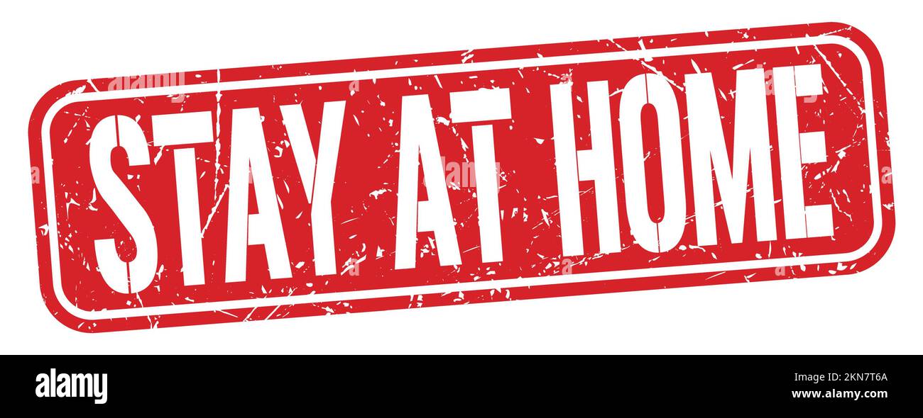 STAY AT HOME text written on red grungy stamp sign Stock Photo - Alamy