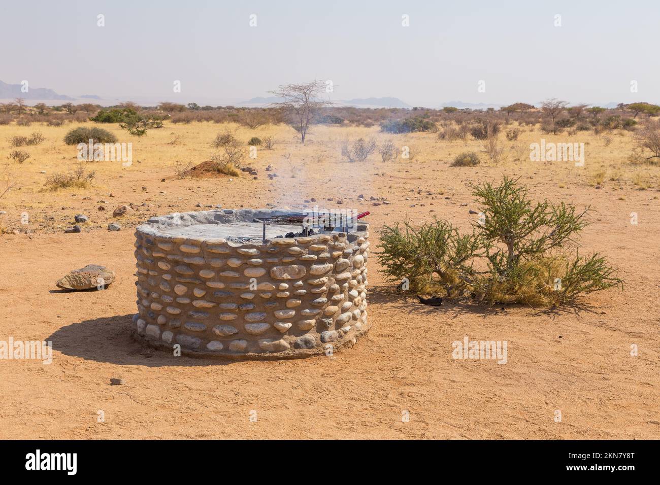 Stone grill at the campsite. Solitaire Desert Farm. Savanna in the ...