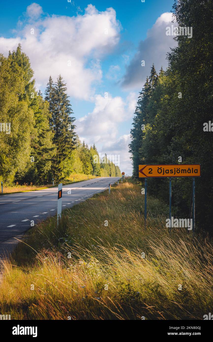 A vertical shot of Ojasjomala road sign in Sweden Stock Photo - Alamy