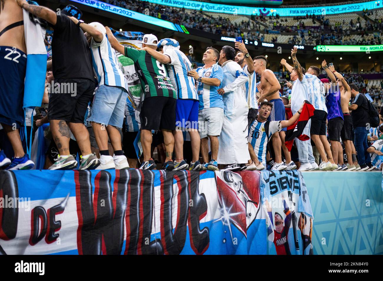 Doha, Qatar. 26th Nov, 2022. Argentine fans celebrate long after the ...