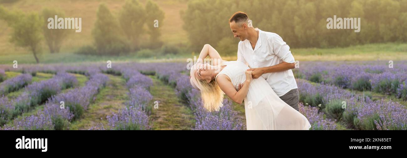 Couple in lavender field. Couple in hug Stock Photo - Alamy