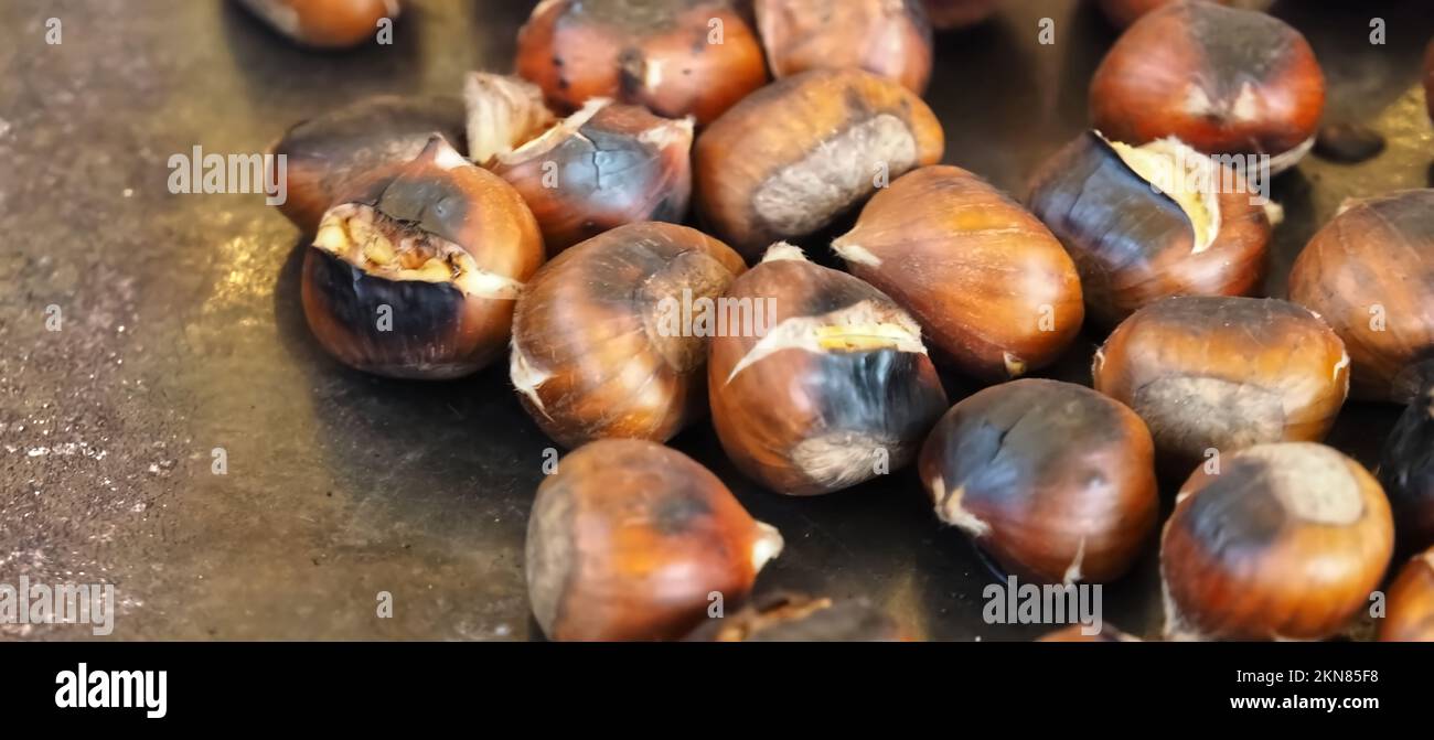 Hot oven roasted chestnuts pile Stock Photo - Alamy