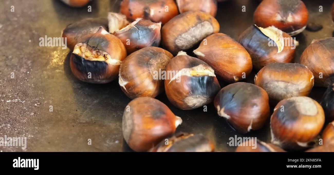 Hot oven roasted chestnuts pile Stock Photo - Alamy