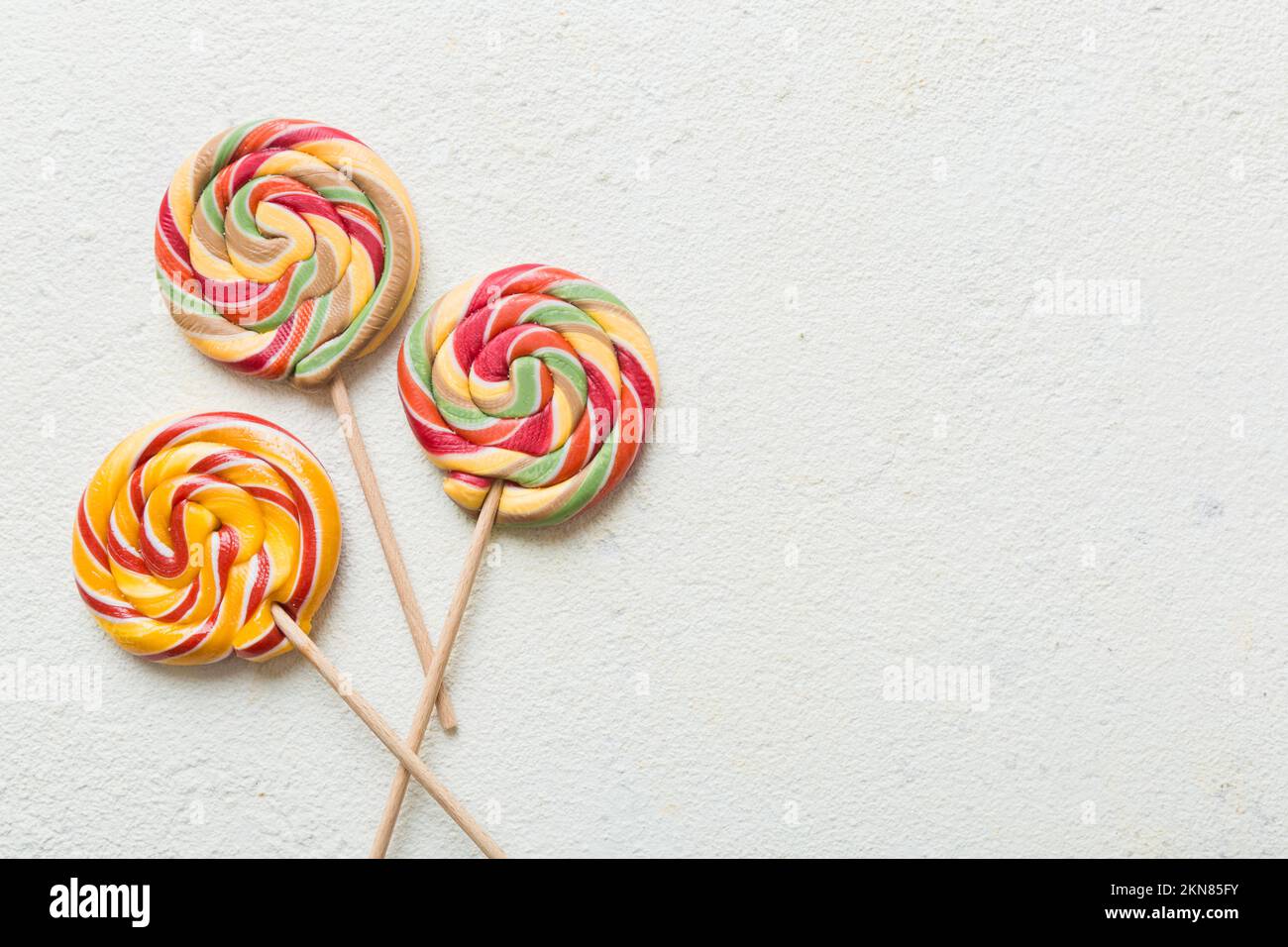 Set of colorful lollipops on colored background. Summer concept. Party ...