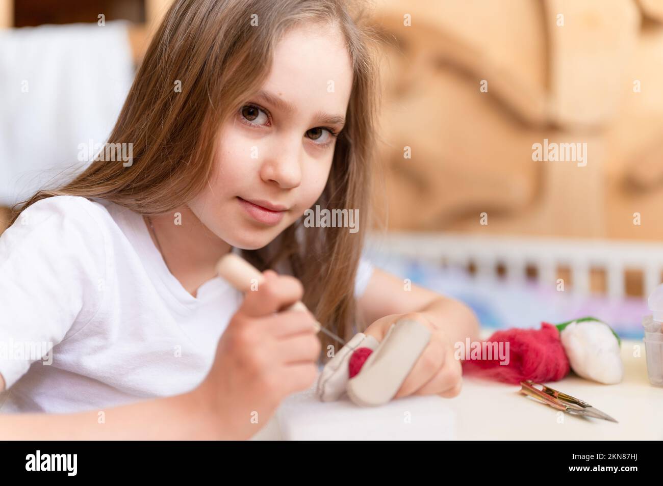 felt wool craft by handmade with needle. little kid girl artisan nine ...