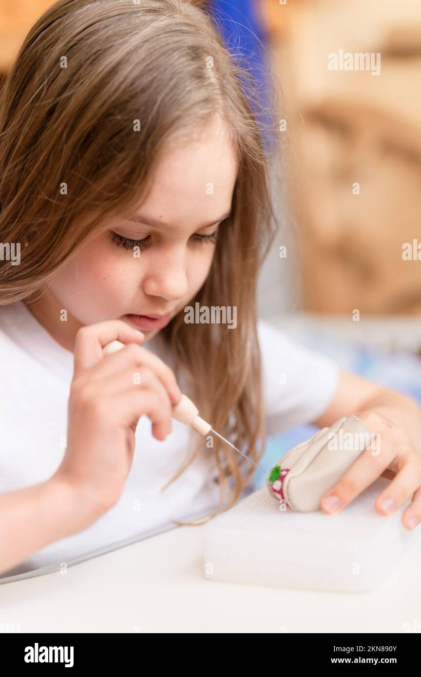 felt wool craft by handmade with needle. little kid girl artisan nine ...