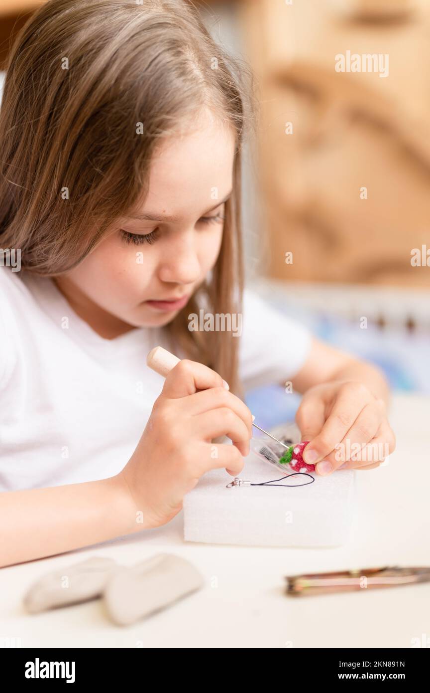 felt wool craft by handmade with needle. little kid girl artisan nine ...