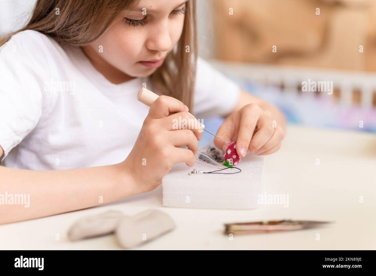 felt wool craft by handmade with needle. little kid girl artisan nine ...