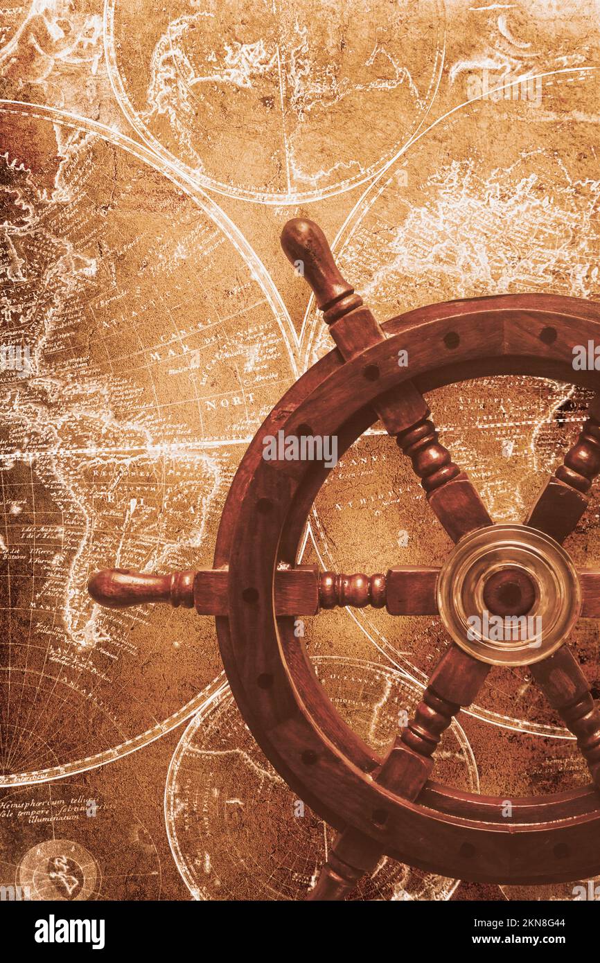 Creative photo composition of a ship helm on world navigation map ...