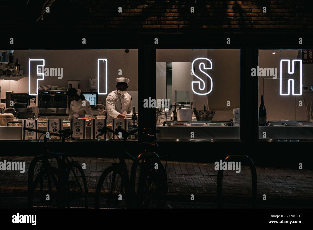 The restaurant workers in a seafood restaurant at night Stock Photo - Alamy