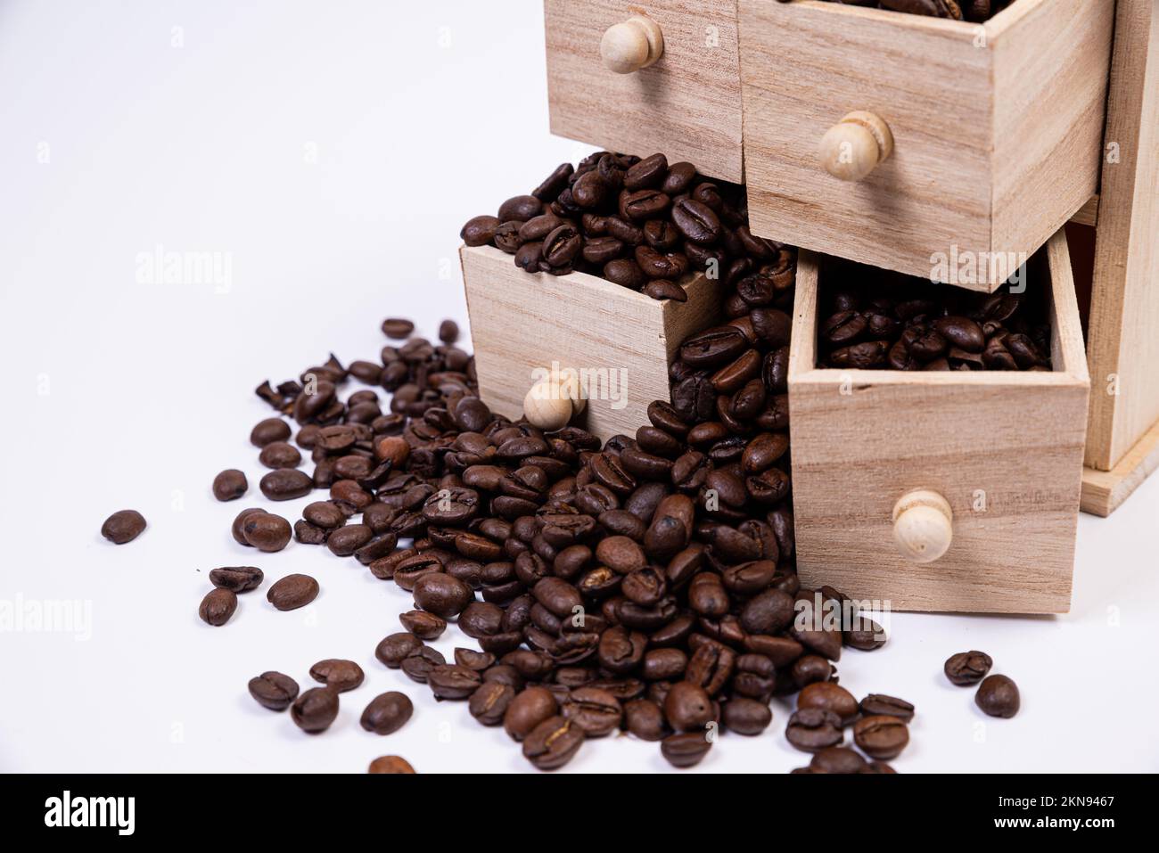 Wooden box with cells filled with coffee beans. Coffee beans scattered ...