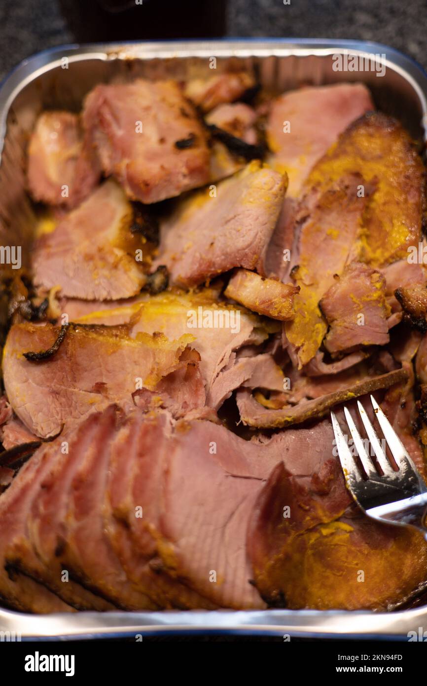 a top down view of a pan filled with slices of ham for a family ...