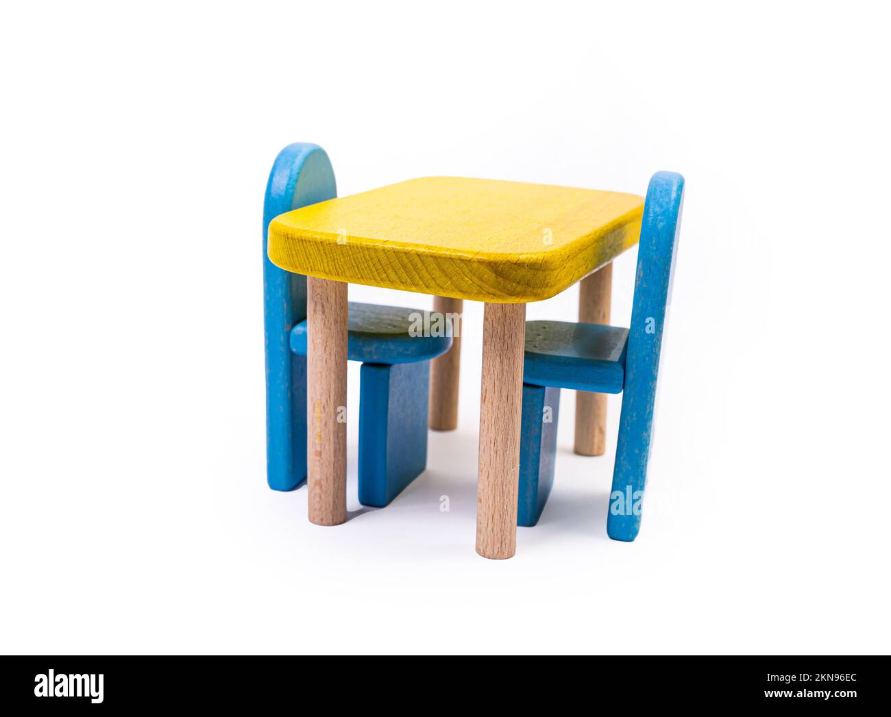 a wooden blue toy chair, a sofa, two chairs with a table, a yellow ...