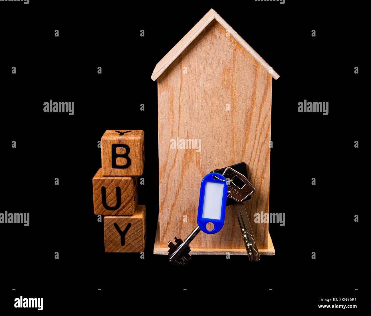 wooden house mockup with house keys, wooden cubes with words rent sale ...