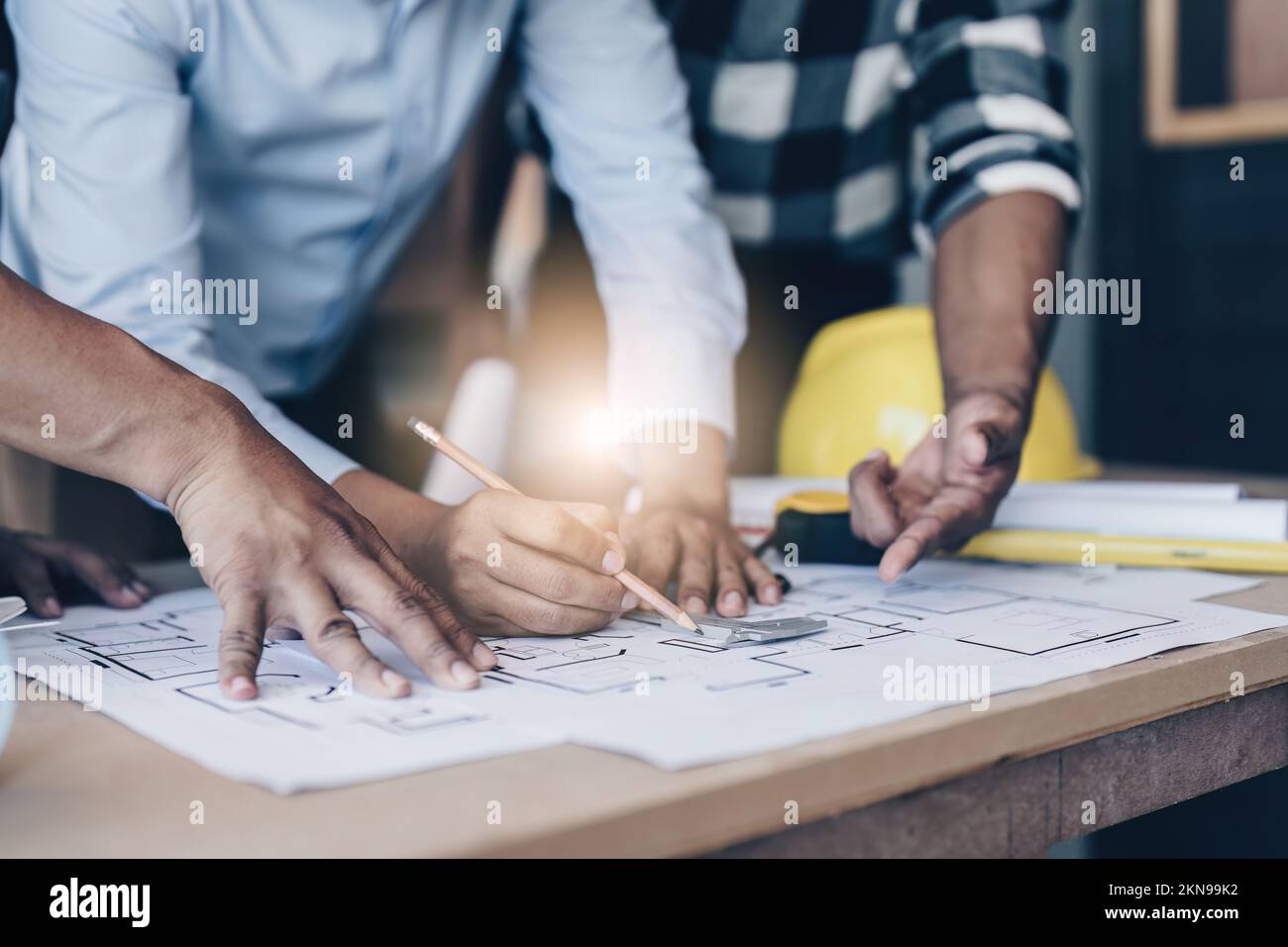 Professional architect designer structural engineer team colleagues discussing building plan ...