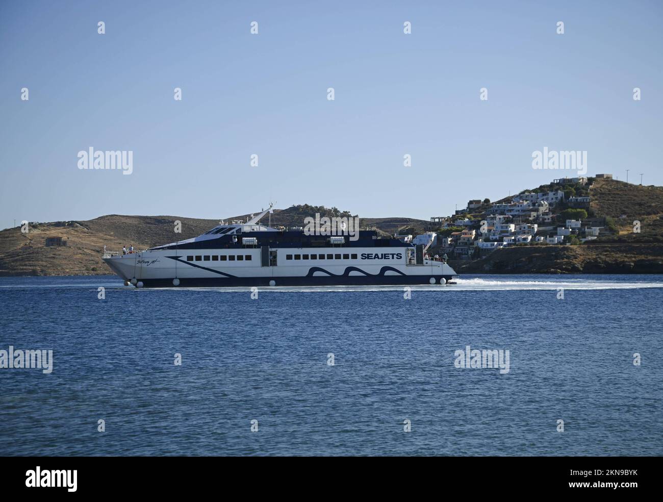 Landscape with scenic view of a ferry boat leaving the port of Korissia ...