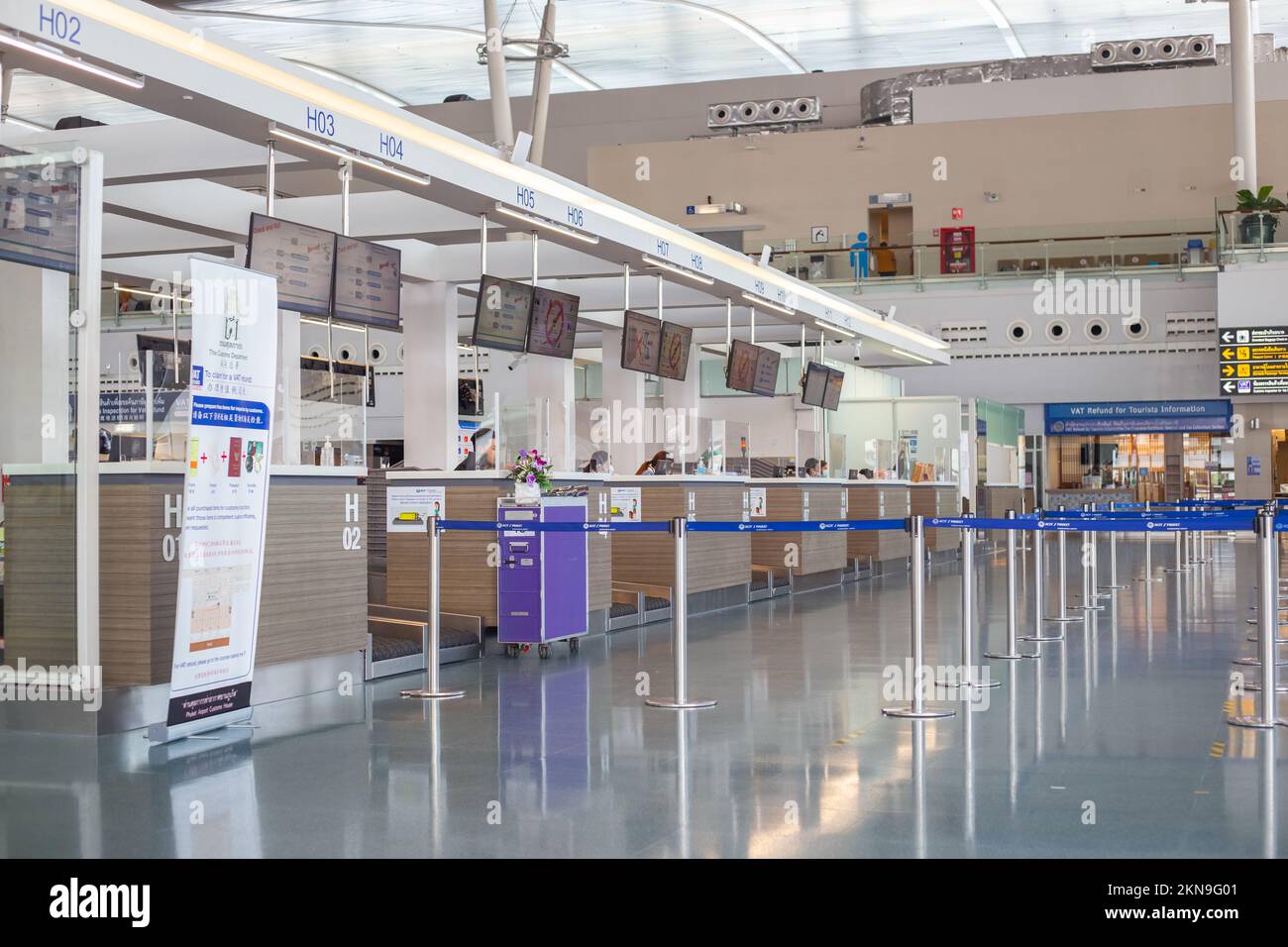 Airport premises with passenger check-in desks without people. Thailand ...