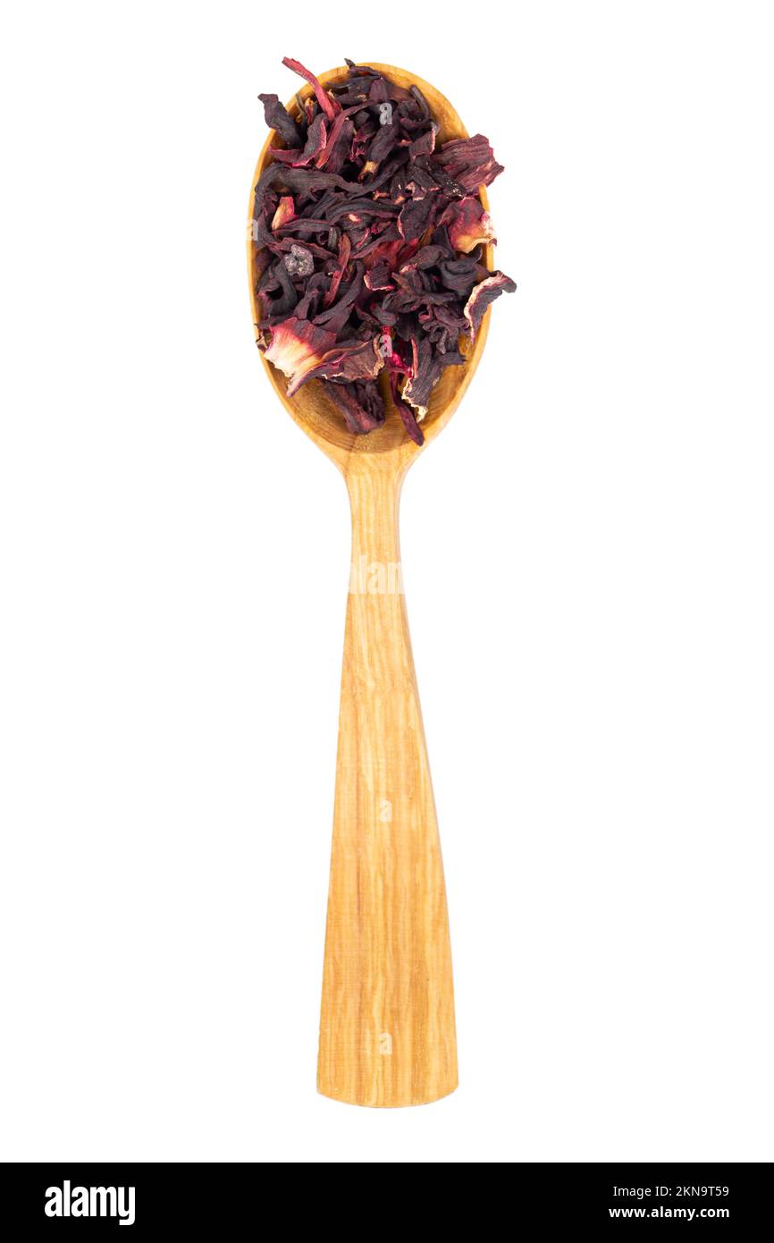 Karkade tea. Hibiscus tea leaves in wooden spoon isolated on white ...